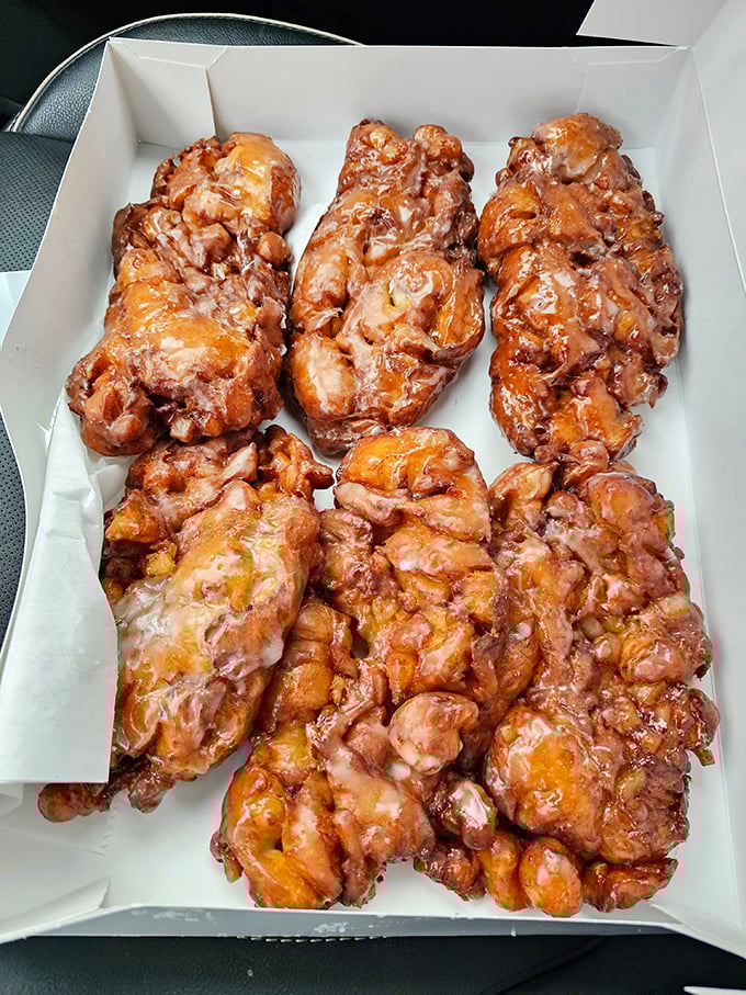 These apple fritters aren't just pastries&mdash;they're architectural marvels of caramelized dough, apple chunks, and glaze that would make Michelangelo weep.