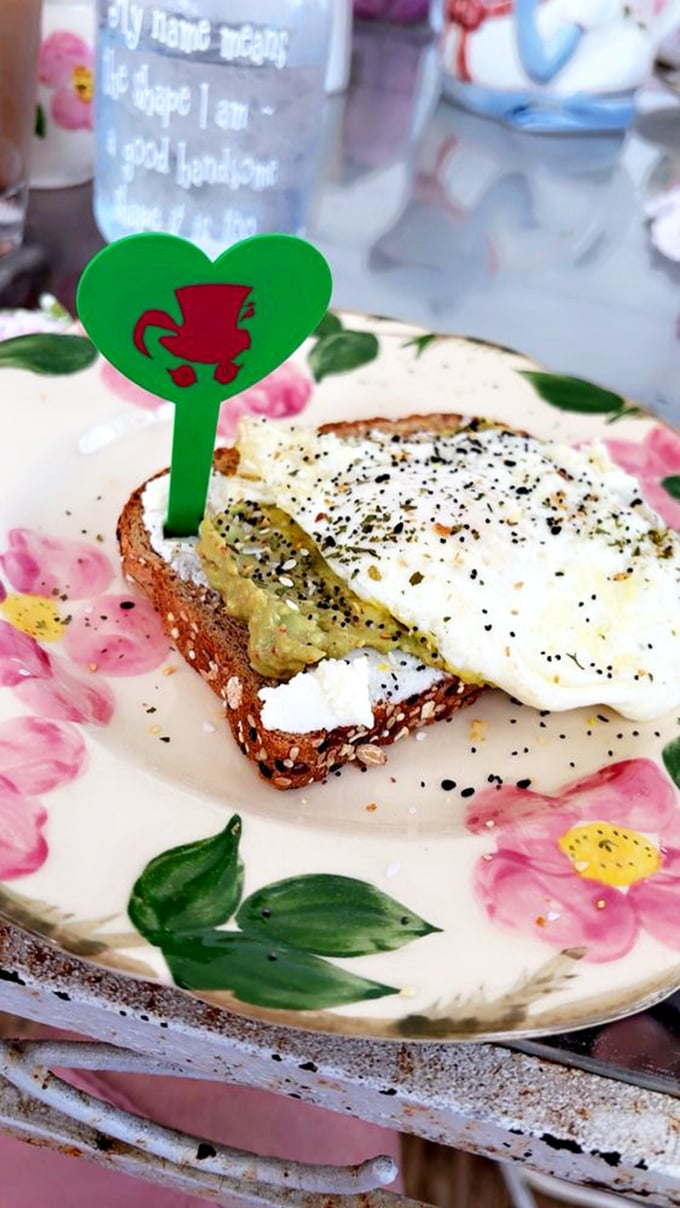 This isn't just avocado toast&mdash;it's edible art. The perfectly cooked egg and sprinkle of seasonings would make even the Queen of Hearts smile.
