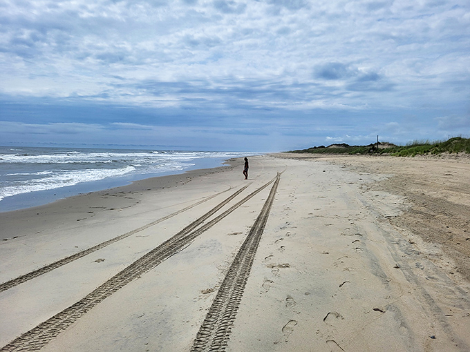 Social distancing before it was trendy&mdash;this lone figure reminds us that sometimes the best company is simply the rhythm of waves.