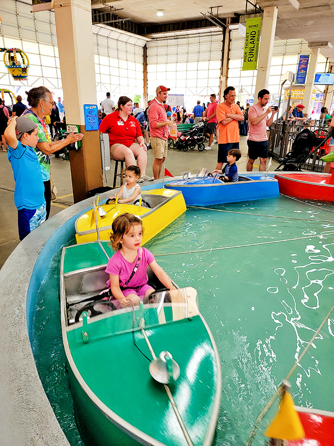 Tiny captains navigate their vessels with serious determination. The boat ride&mdash;where maritime dreams begin and parents capture perfect photo ops.