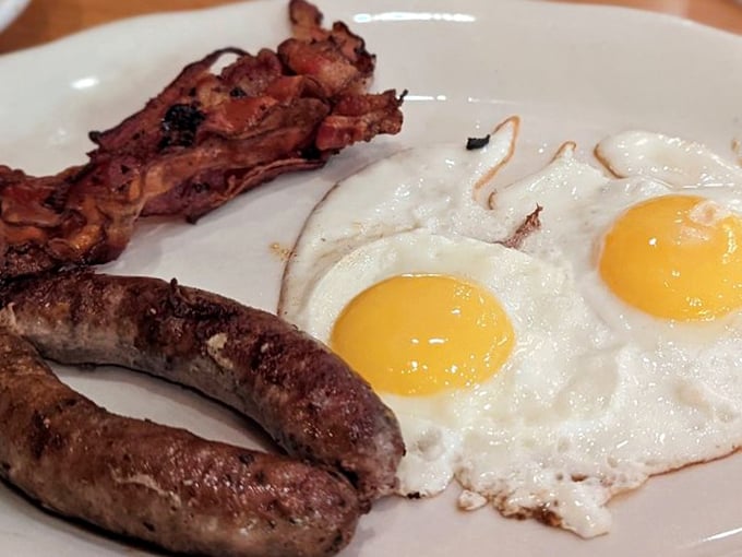 Perfectly cooked eggs, sausage with that satisfying snap, and bacon crisped to perfection&mdash;breakfast doesn't get more honest than this.