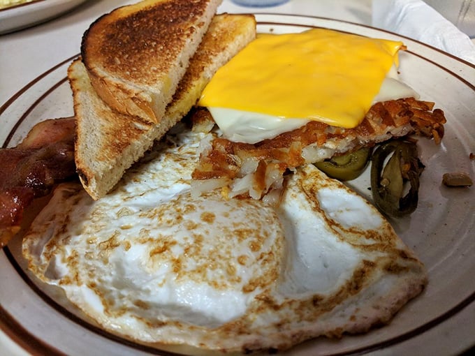 Breakfast perfection on a plate. Those eggs are cooked with the precision of a Swiss watchmaker, and that toast? Golden-brown breakfast real estate.