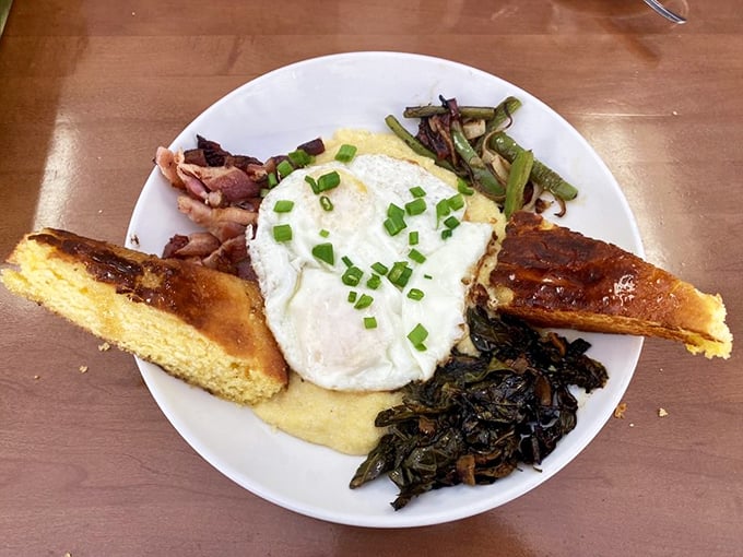 Eggs Benedict gets the Vegas treatment - not with neon and showgirls, but with perfectly poached eggs and greens that didn't come from a bag.