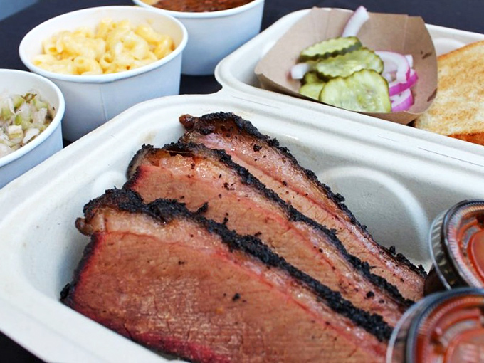 Behold the holy trinity of barbecue: smoke ring, bark, and tender pink center. This brisket doesn't need a prayer&mdash;it's already been blessed.