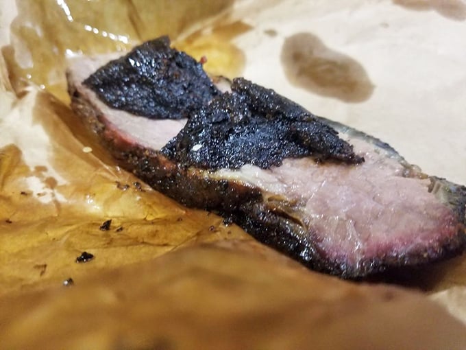Behold the holy trinity of barbecue: perfect bark, pink smoke ring, and meat so tender it practically surrenders at the sight of your fork. 