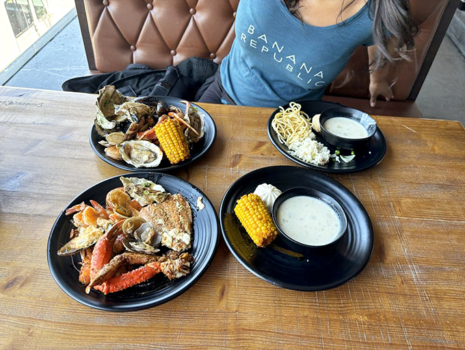 The holy grail of seafood feasting: crab legs, oysters, corn, and butter sauce all sharing one table. Napkins required, restraint optional.