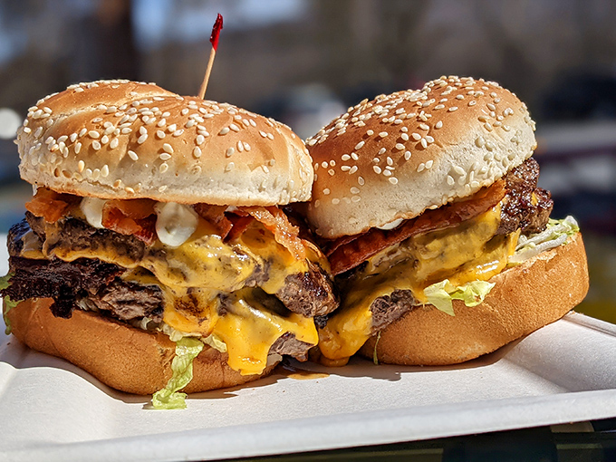 This isn't just a burger&mdash;it's edible architecture. Layers of beef, bacon, and cheese creating a skyscraper of flavor that demands a strategic first bite. 