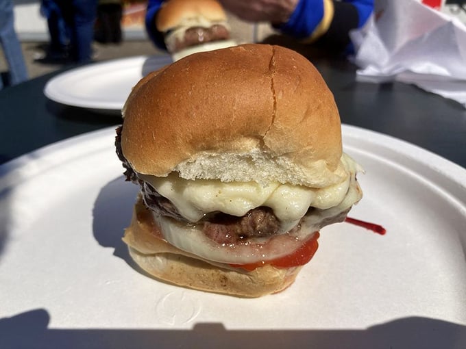 This isn't just a cheeseburger; it's edible nostalgia on a bun. The melted cheese cascades over the patty like a yellow waterfall of happiness.