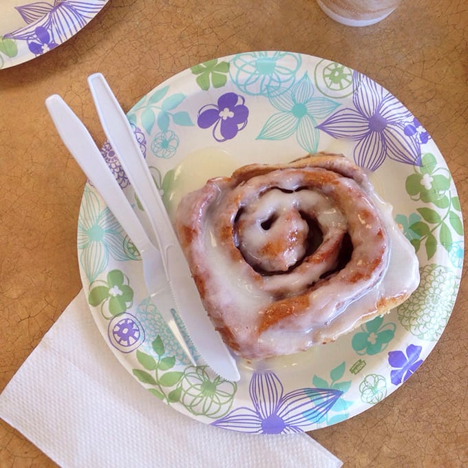 Behold the star of our show: a perfect spiral of dough, cinnamon, and frosting that makes grown adults weak at the knees.