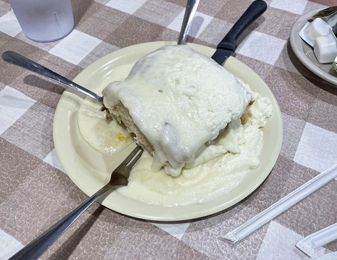 The legendary cinnamon roll doesn't just arrive at your table &ndash; it makes an entrance. Frosting cascades down the sides like a delicious avalanche.