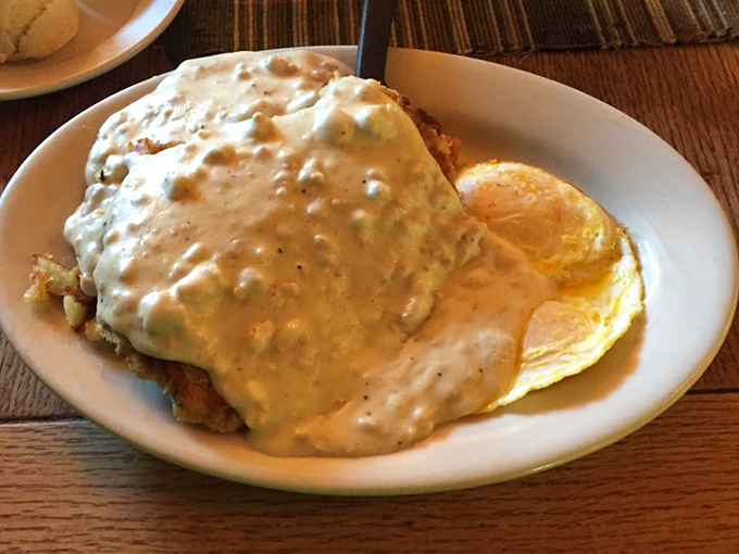 Behold the legendary country fried steak&mdash;a crispy, golden masterpiece swimming in creamy gravy that's worth every mile of the journey.
