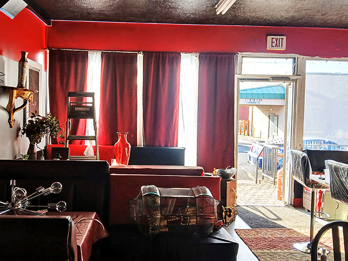 The red room setup feels like stumbling onto a film set. Vintage furniture arranged just so, waiting for its next starring role in someone's home.