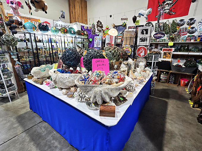 Maritime treasures abound in this nautical nook. That ship's wheel has probably seen more authentic adventures than most Instagram influencers.