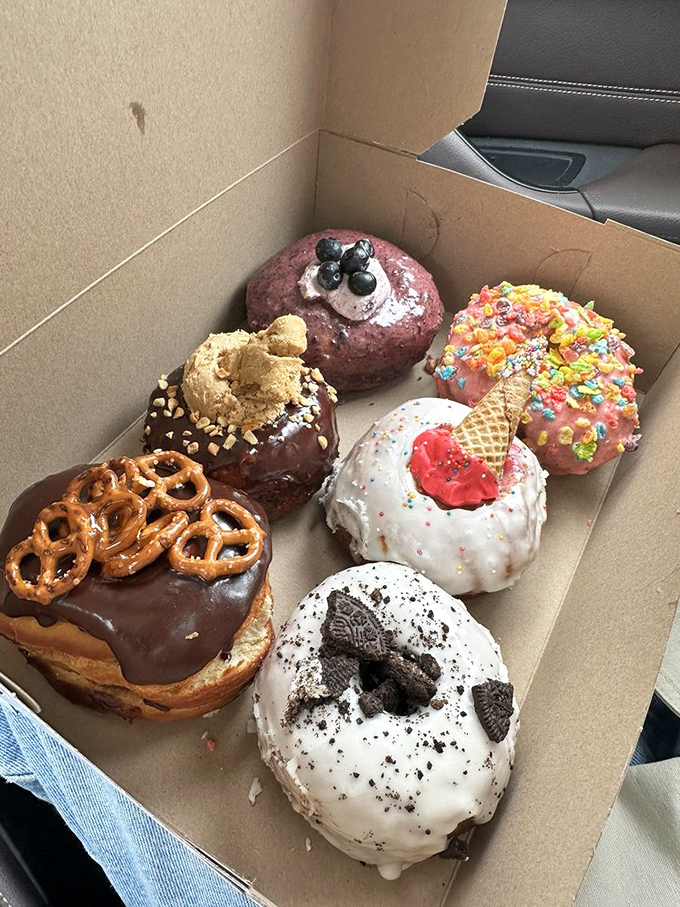 Donut heaven in a box! Each one a unique personality &ndash; from the chocolate-pretzel extrovert to the shy-but-complex blueberry introvert.