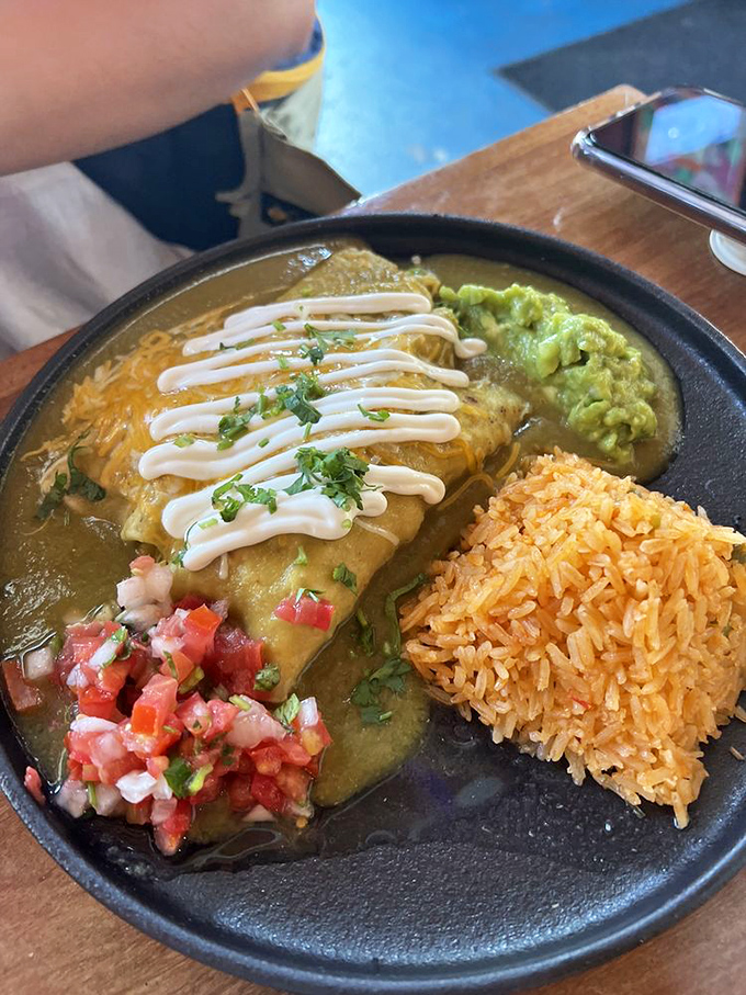 These rolled tacos aren't just served&mdash;they're presented like the rock stars they are. The sauce drizzle is basically edible artwork. 