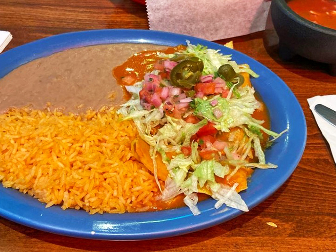 Like a Jackson Pollock of Mexican flavors, this enchilada plate comes alive with bright red sauce, fresh pico, and those perfectly placed jalape&ntilde;o slices.