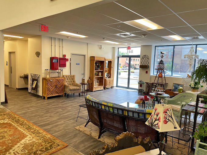 The front entrance welcomes you with carefully curated displays, like the appetizer round of a feast where every chair has a story to tell.