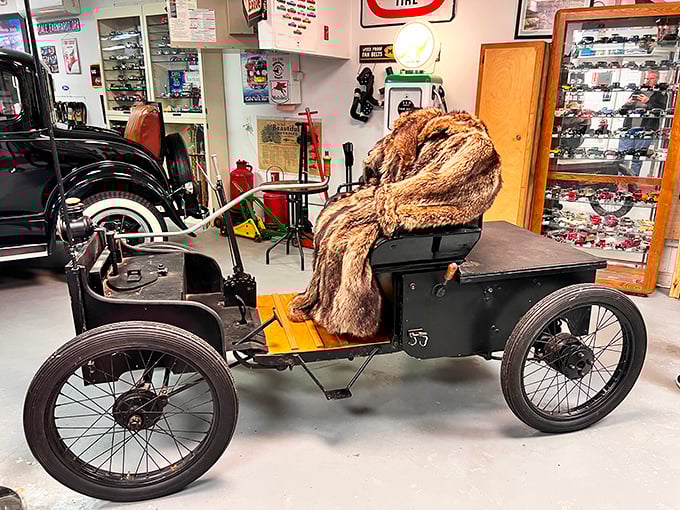 Early motoring required fur coats and courage in equal measure. This tiny marvel reminds us that road trips once qualified as genuine adventures.