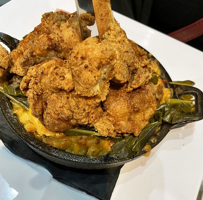Golden-crusted fried chicken perched atop a bed of greens&mdash;proof that sometimes the simplest pleasures deliver the most profound satisfaction.