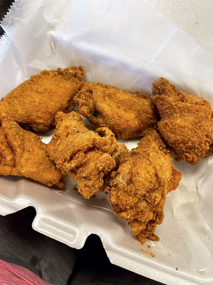 Golden-brown perfection that makes Colonel Sanders weep with jealousy. This fried chicken's crackling exterior guards juicy meat that's worth every calorie.