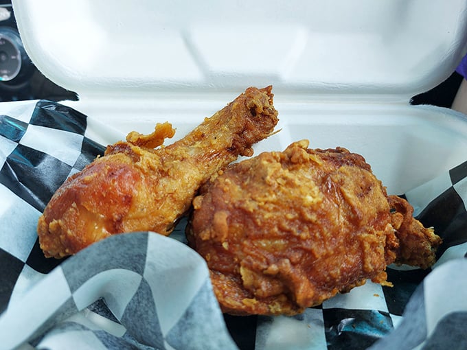 Golden-brown perfection in a takeout box. This isn't just fried chicken; it's edible proof that sometimes the simplest pleasures are the most profound.