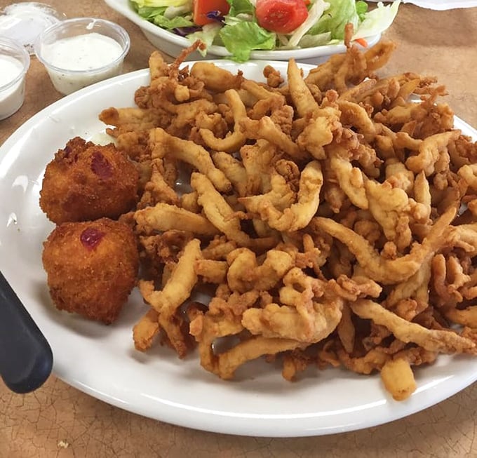 Golden-fried clams piled high on a plate&mdash;crispy, tender, and worth every mile of your journey to this Oklahoma seafood haven.