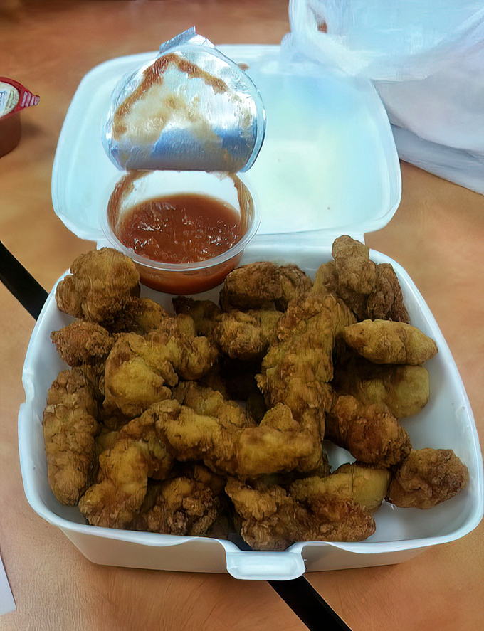 Golden-fried clams that crunch like autumn leaves, with a tender interior that makes you forget every rubbery impostor you've ever encountered.