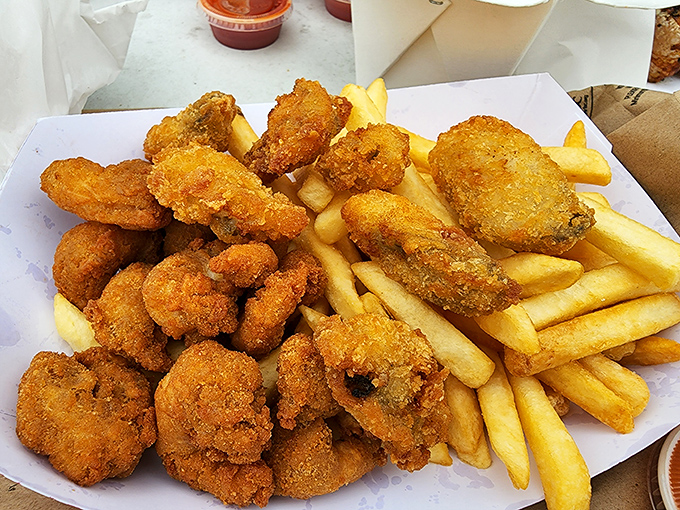 Golden treasures from the deep! These fried clams and fries aren't just food&mdash;they're edible proof that perfection needs no fancy presentation.