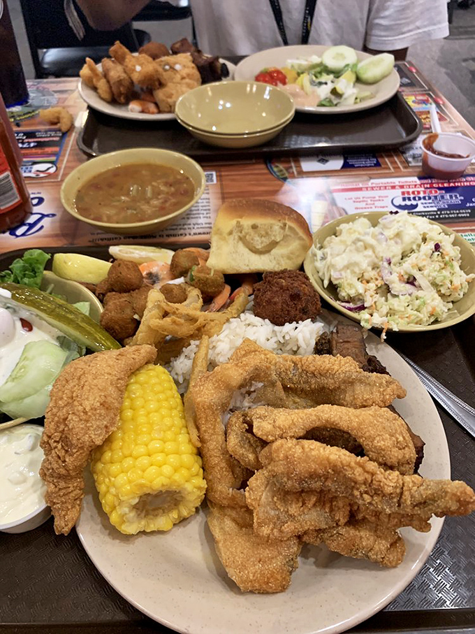 Food tetris at its finest! Somehow they've managed to fit corn on the cob, catfish, hushpuppies, and sides on one plate&mdash;challenge accepted.