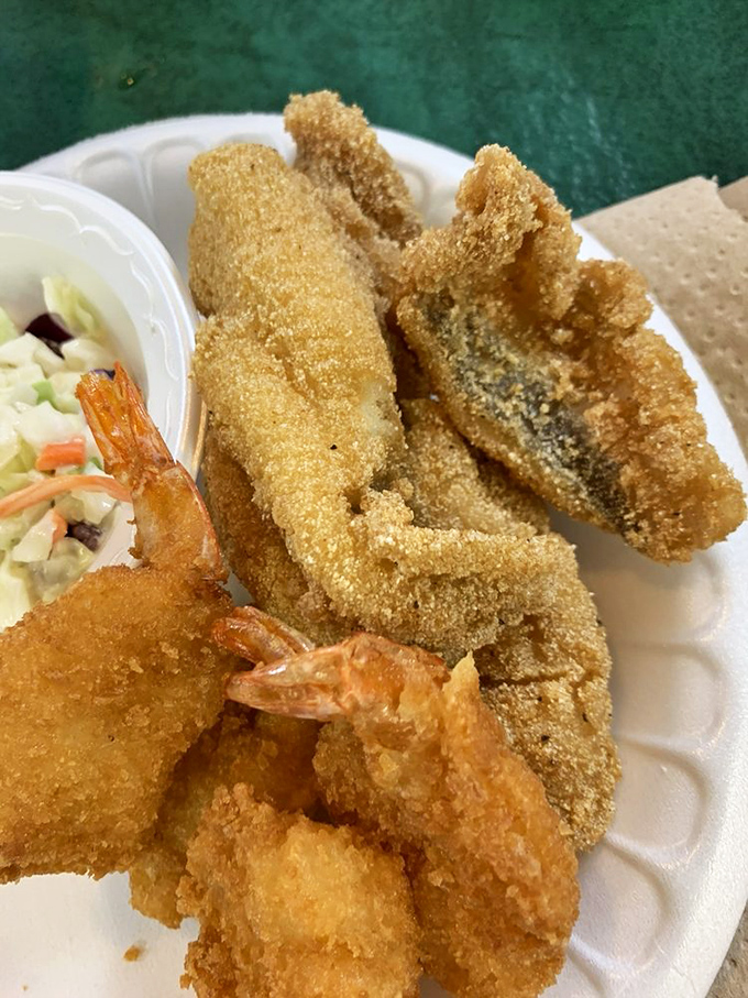 Crispy cornmeal-crusted catfish and plump fried shrimp share plate space with coleslaw&mdash;a Southern trinity more revered than many religious experiences.