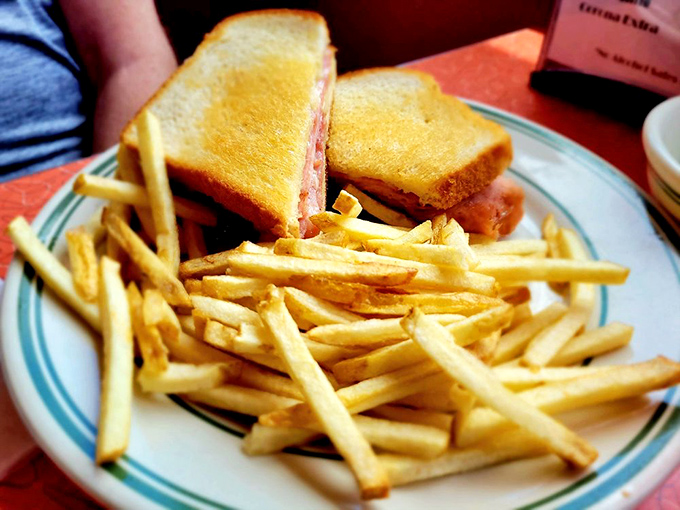 The humble grilled cheese elevated to art form. Golden-brown perfection meets melty goodness, with a mountain of hand-cut fries that puts fast food to shame.