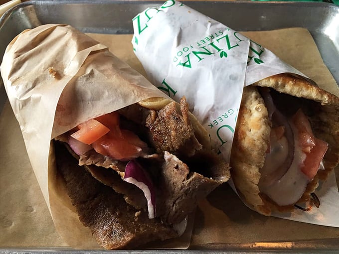 These aren't your mall food court gyros. Perfectly seasoned meat, garden-fresh veggies, and that pillowy pita create the holy trinity of handheld heaven.