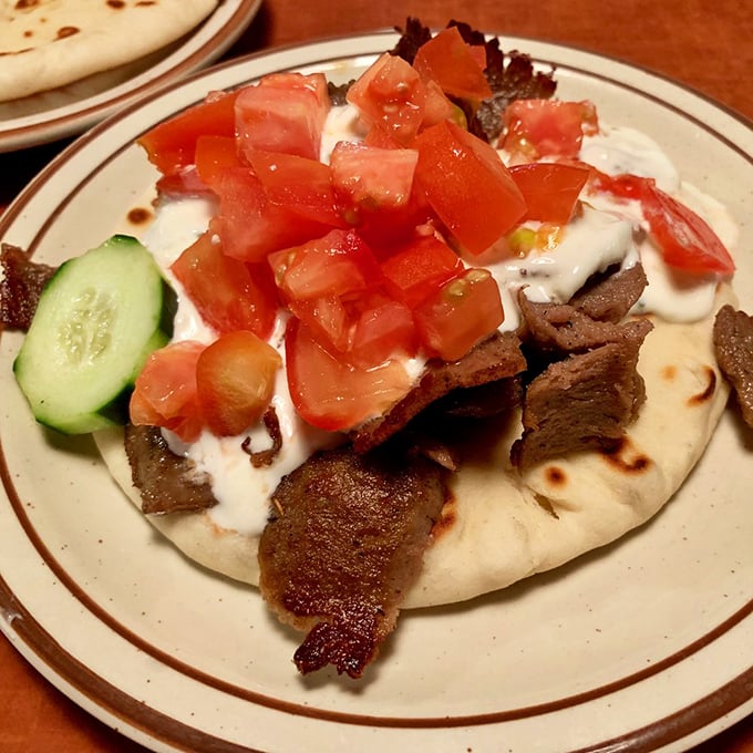 The star of the show arrives! Tender, seasoned meat nestled in pillowy pita with cool tzatziki and fresh veggies&mdash;a handheld vacation to Athens.