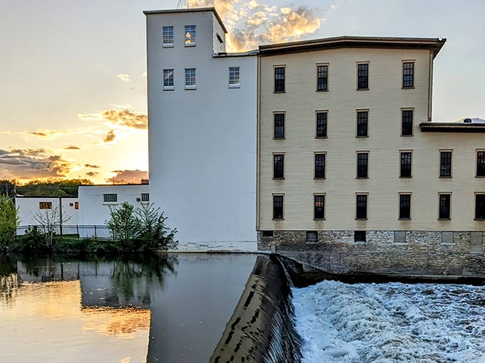 Where industry meets artistry &ndash; the historic mill building reflects in the Cannon River like it's admiring its own century-old good looks.