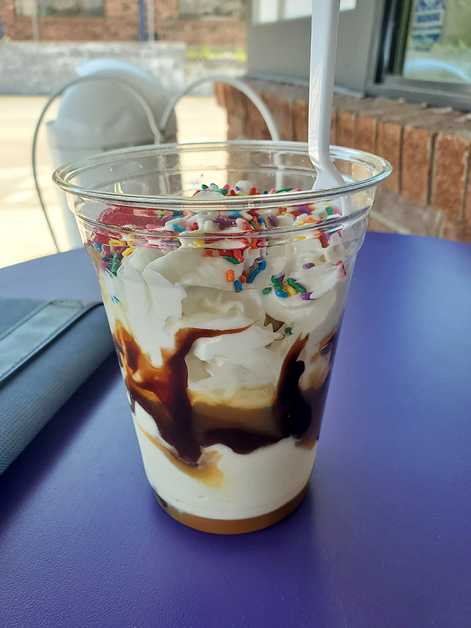 Layers of vanilla soft serve, chocolate sauce, and rainbow sprinkles&mdash;proof that sometimes the best architecture is edible.