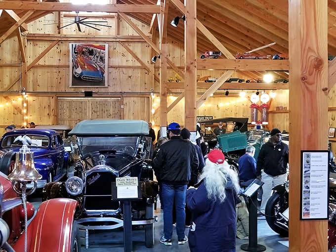 History parked in perfect formation. Visitors wander among automotive legends while warm wood surrounds these mechanical time capsules.