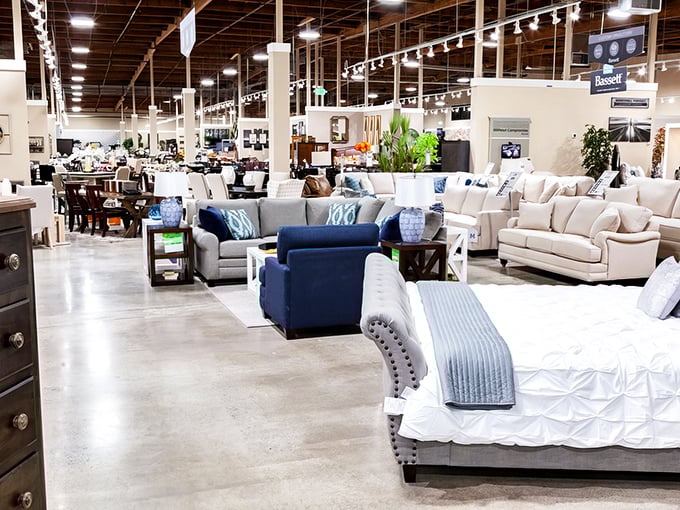 The showroom stretches toward the horizon like a furniture mirage, with cozy bedroom displays that make your current sleeping arrangements seem like camping.