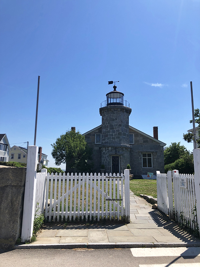 Stonington's historic lighthouse stands sentinel, its weathered stone walls having guided mariners home since 1840.
