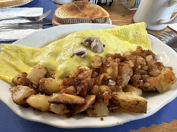 This omelet doesn't need Instagram filters&mdash;just your undivided attention. Golden perfection outside, pillowy inside, with home fries that deserve their own fan club.