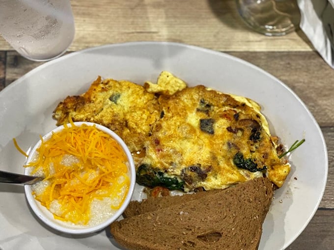 This isn't just any omelet&mdash;it's a fluffy canvas of egg perfection dotted with savory fillings that make morning worth facing.