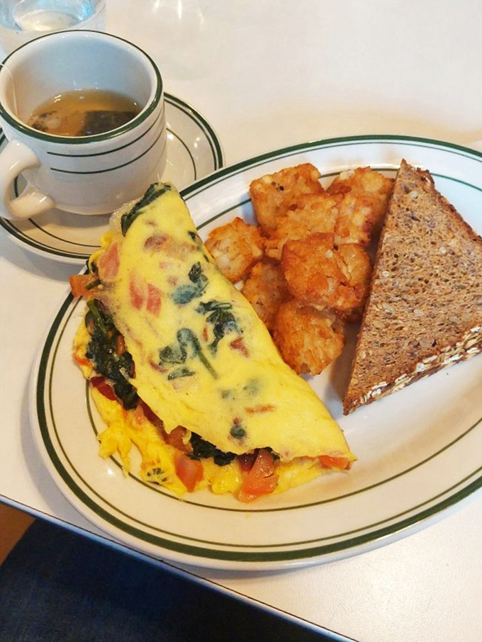 This isn't just any omelette&mdash;it's a masterclass in egg architecture with vegetables folded in like treasured secrets.