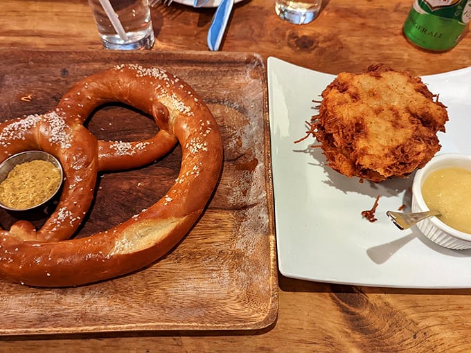 The pretzel arrives like a bronzed ambassador of dough diplomacy, its perfect salt-studded exterior practically begging to be torn apart.