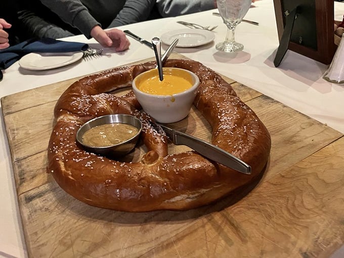 This isn't just a pretzel&mdash;it's a golden-brown masterpiece of dough engineering, complete with cheese sauce that should be classified as a controlled substance.