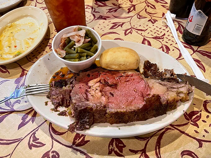 The prime rib arrives like a meat masterpiece&mdash;perfectly pink, seasoned crust, with green beans and a potato that could make Idaho jealous.