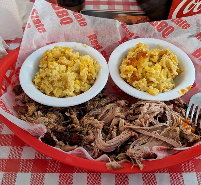 Pulled pork so tender it practically surrenders to your fork, paired with corn pudding that would make your grandmother jealous.