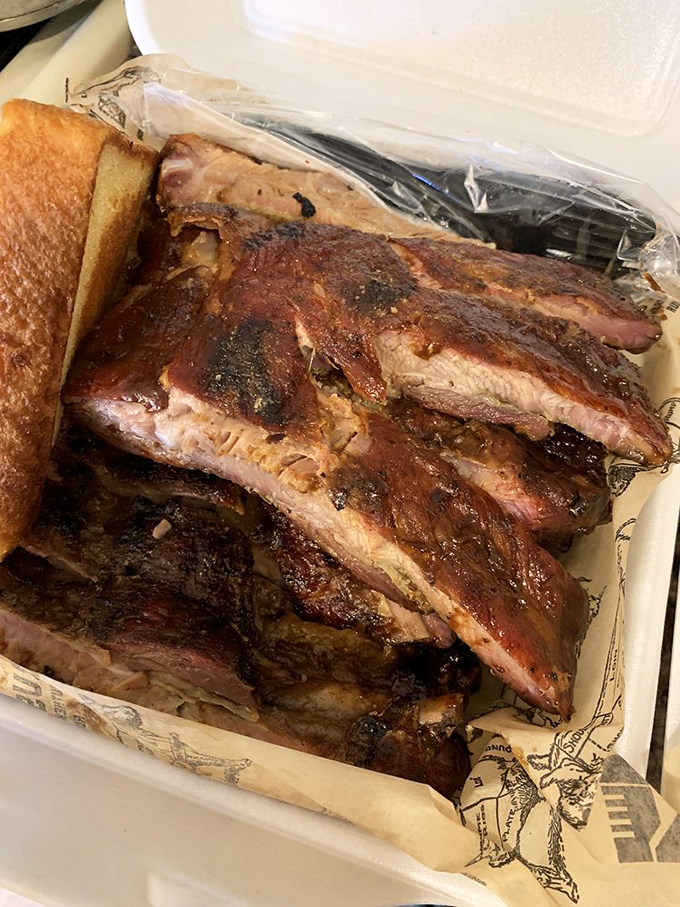 These ribs showcase that perfect pink smoke ring that barbecue dreams are made of – tender perfection awaits.