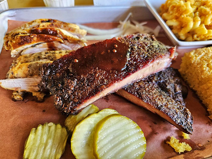 Behold the holy trinity of barbecue &ndash; ribs with that perfect bark, tender chicken, and a side of mac and cheese that's worth every calorie.