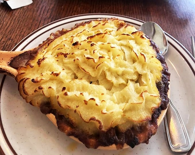 The crown jewel of comfort food: a shepherd's pie with perfectly browned potato peaks hiding a savory treasure of meat and vegetables below.