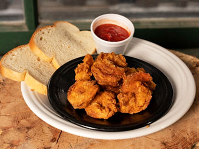 Golden-fried shrimp that snap with each bite, served with bread and sauce that'll have you plotting your next visit before finishing your first.