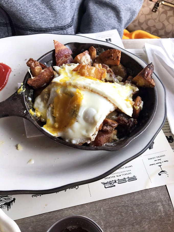 Breakfast nirvana arrives in cast iron. This skillet's perfect eggs crown a mountain of crispy potatoes in what can only be described as morning bliss.